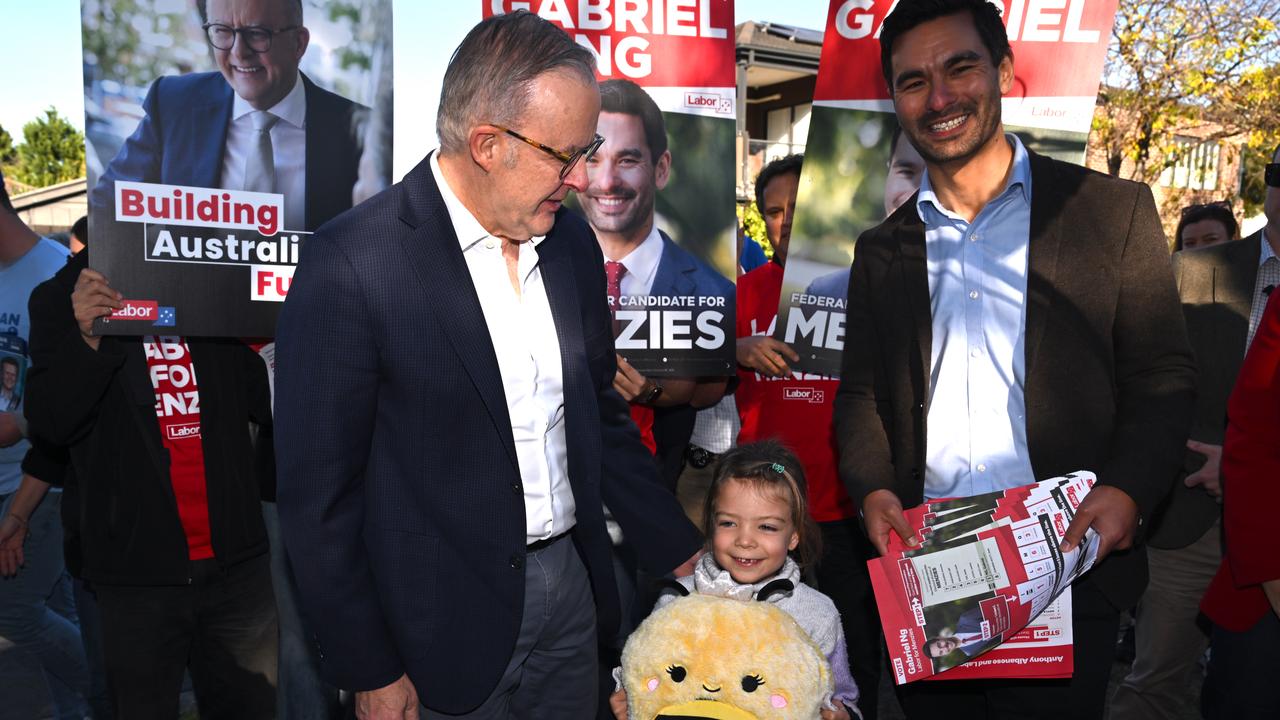 Ballot booths abuzz as PM makes last-ditch visit