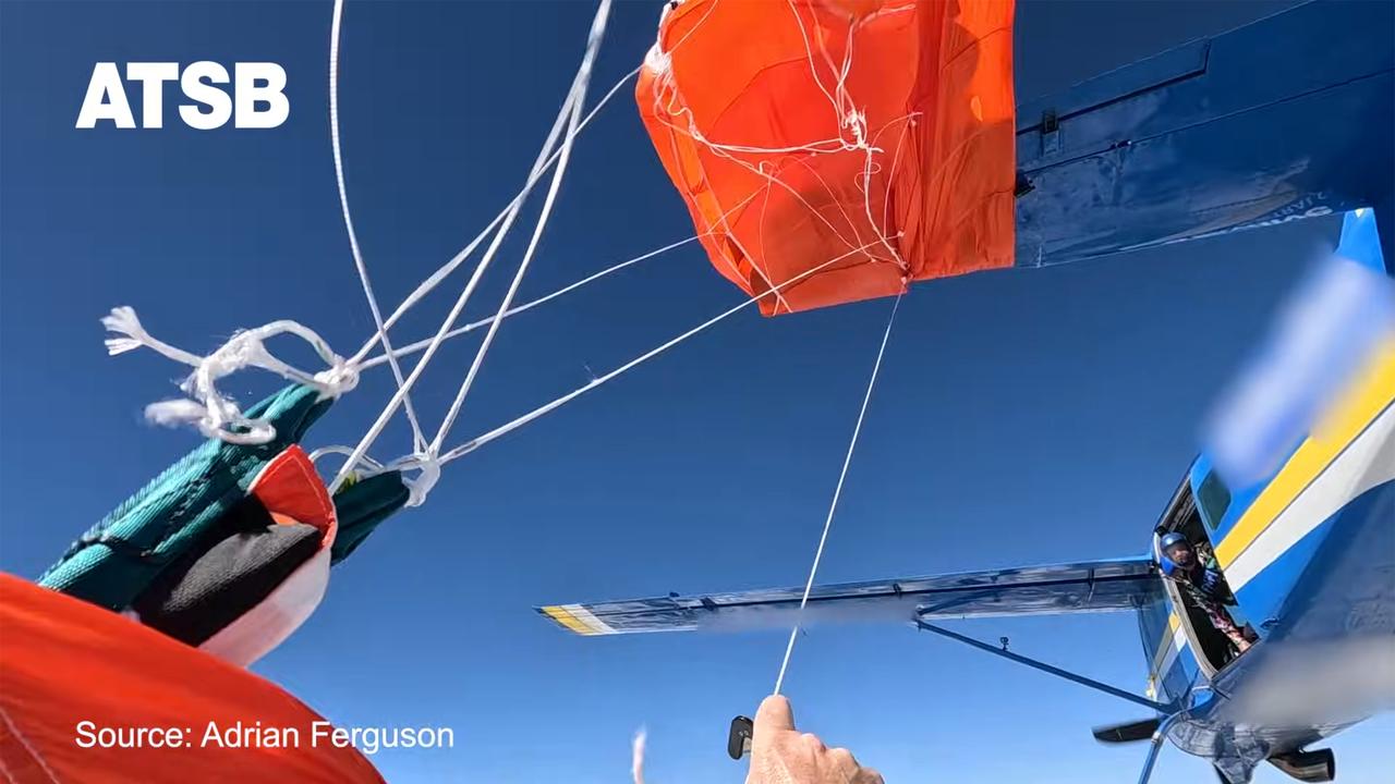 Skydiver hangs from plane tail, snared by own chute
